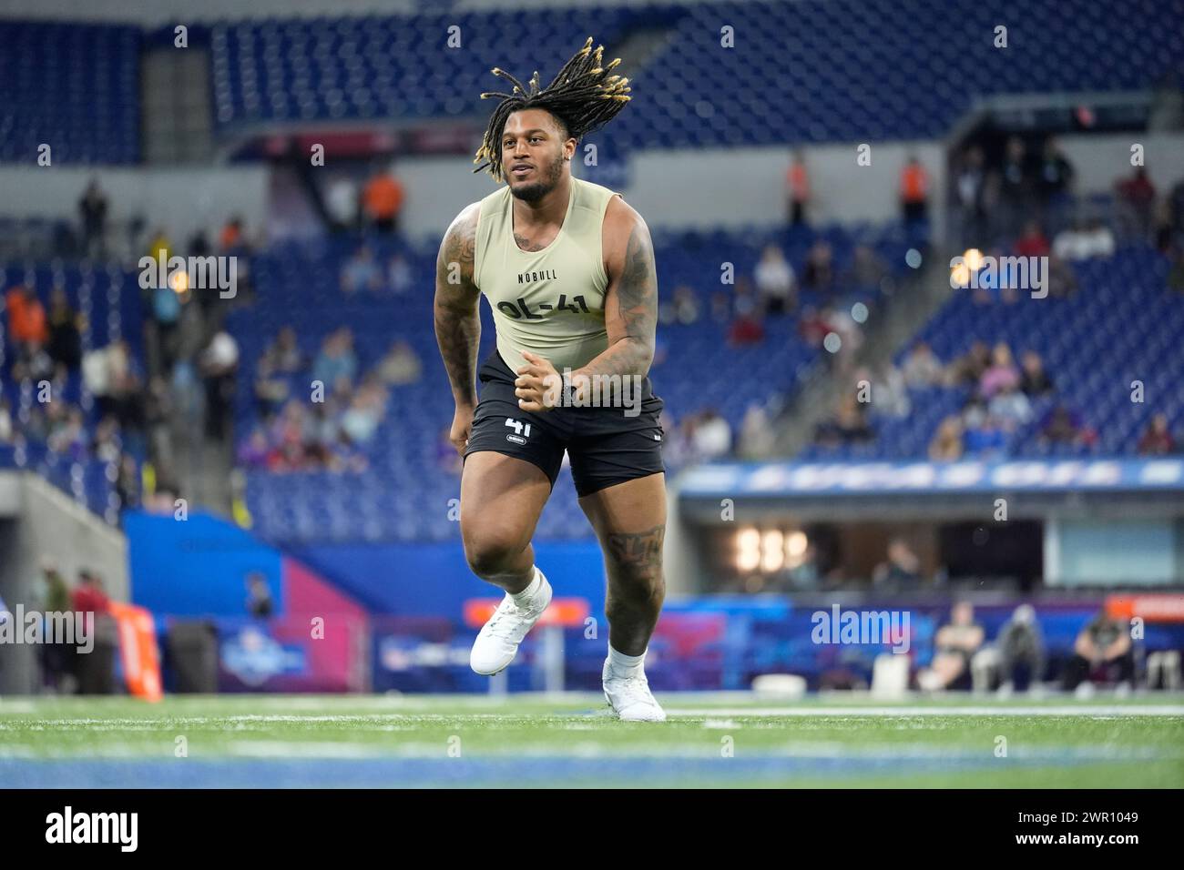 Alabama offensive lineman JC Latham runs a drill at the NFL football ...