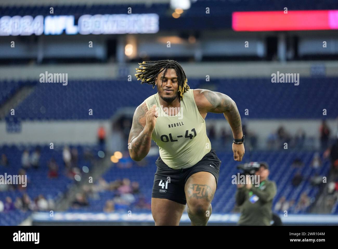 Alabama offensive lineman JC Latham runs a drill at the NFL football ...