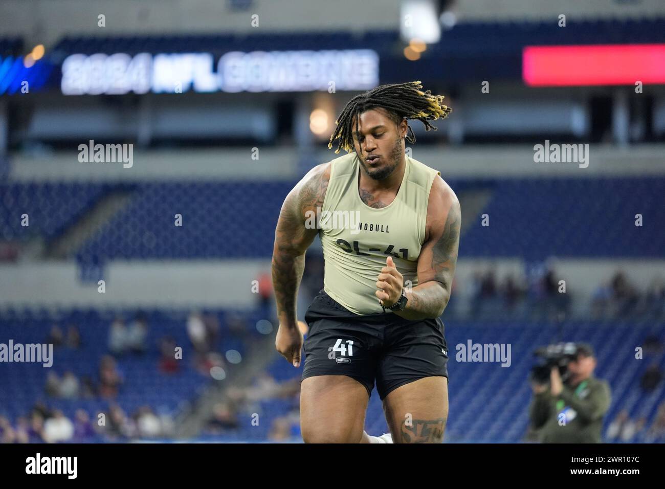 Alabama offensive lineman JC Latham runs a drill at the NFL football ...