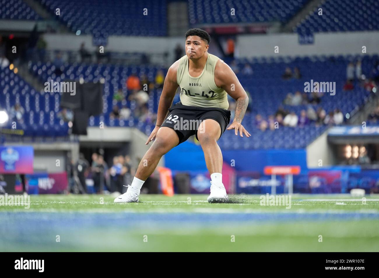 Utah offensive lineman Sataoa Laumea runs a drill at the NFL football ...