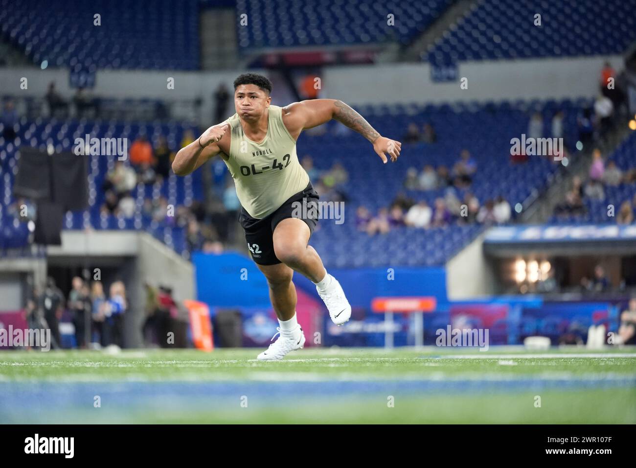 Utah offensive lineman Sataoa Laumea runs a drill at the NFL football ...