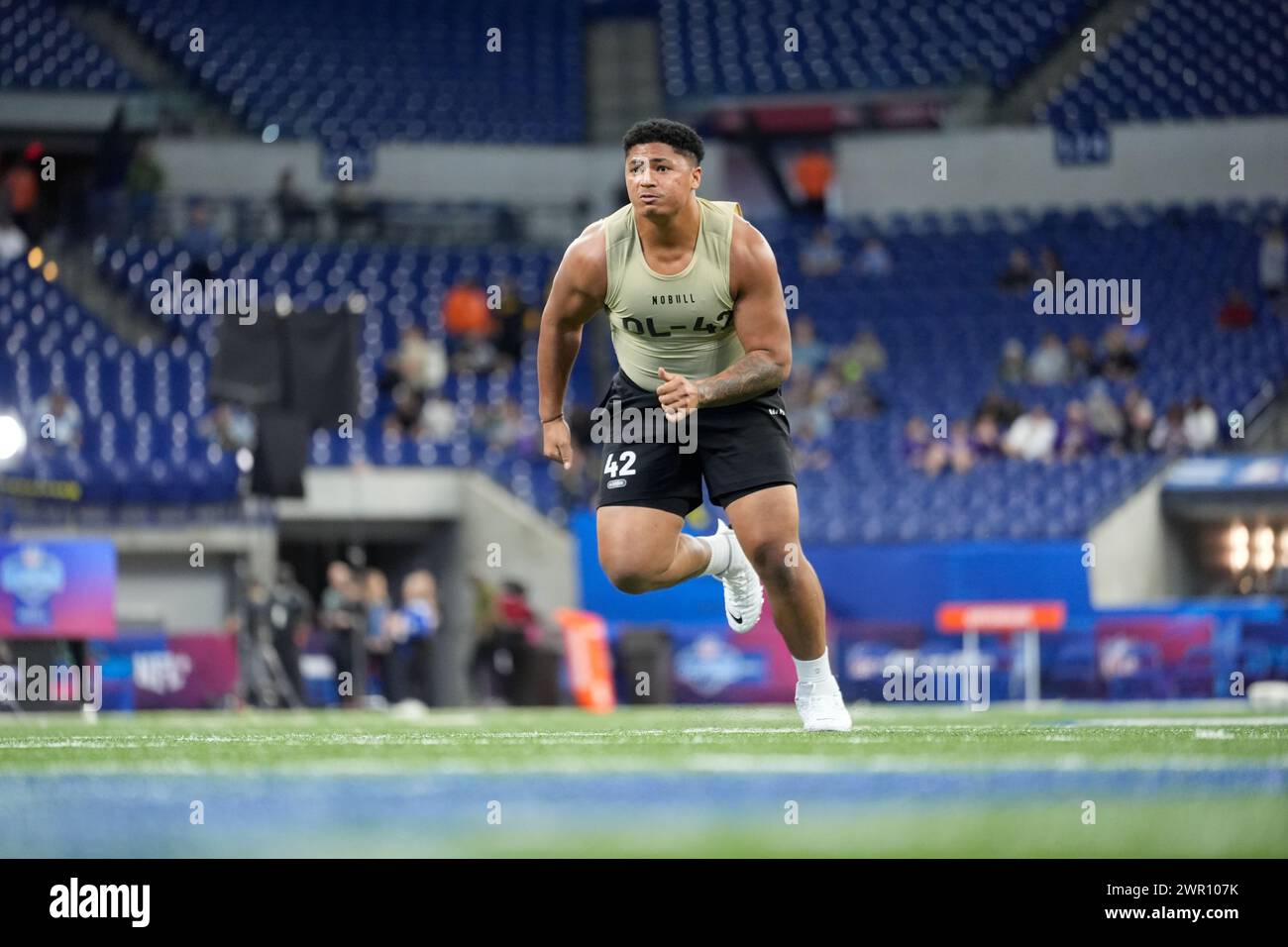 Utah offensive lineman Sataoa Laumea runs a drill at the NFL football ...