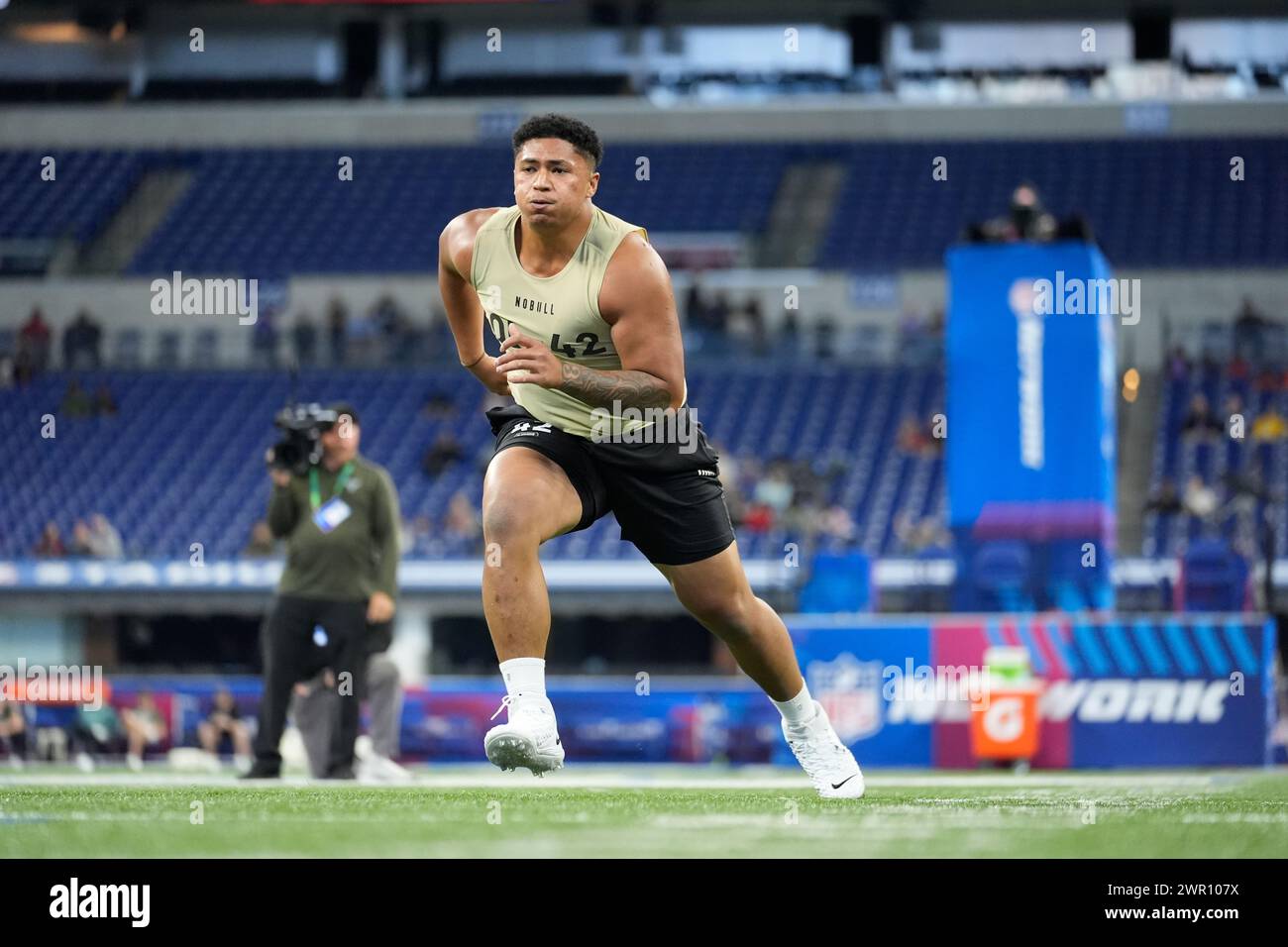 Utah offensive lineman Sataoa Laumea runs a drill at the NFL football ...