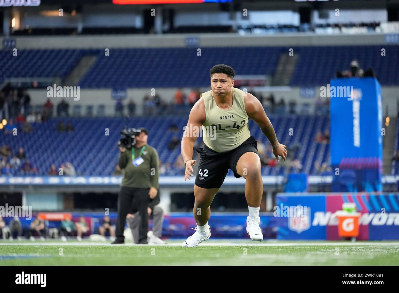Utah offensive lineman Sataoa Laumea runs a drill at the NFL football scouting combine, Sunday ...