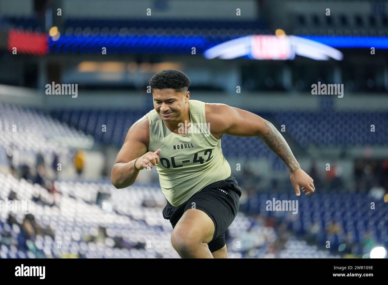 Utah offensive lineman Sataoa Laumea runs a drill at the NFL football ...