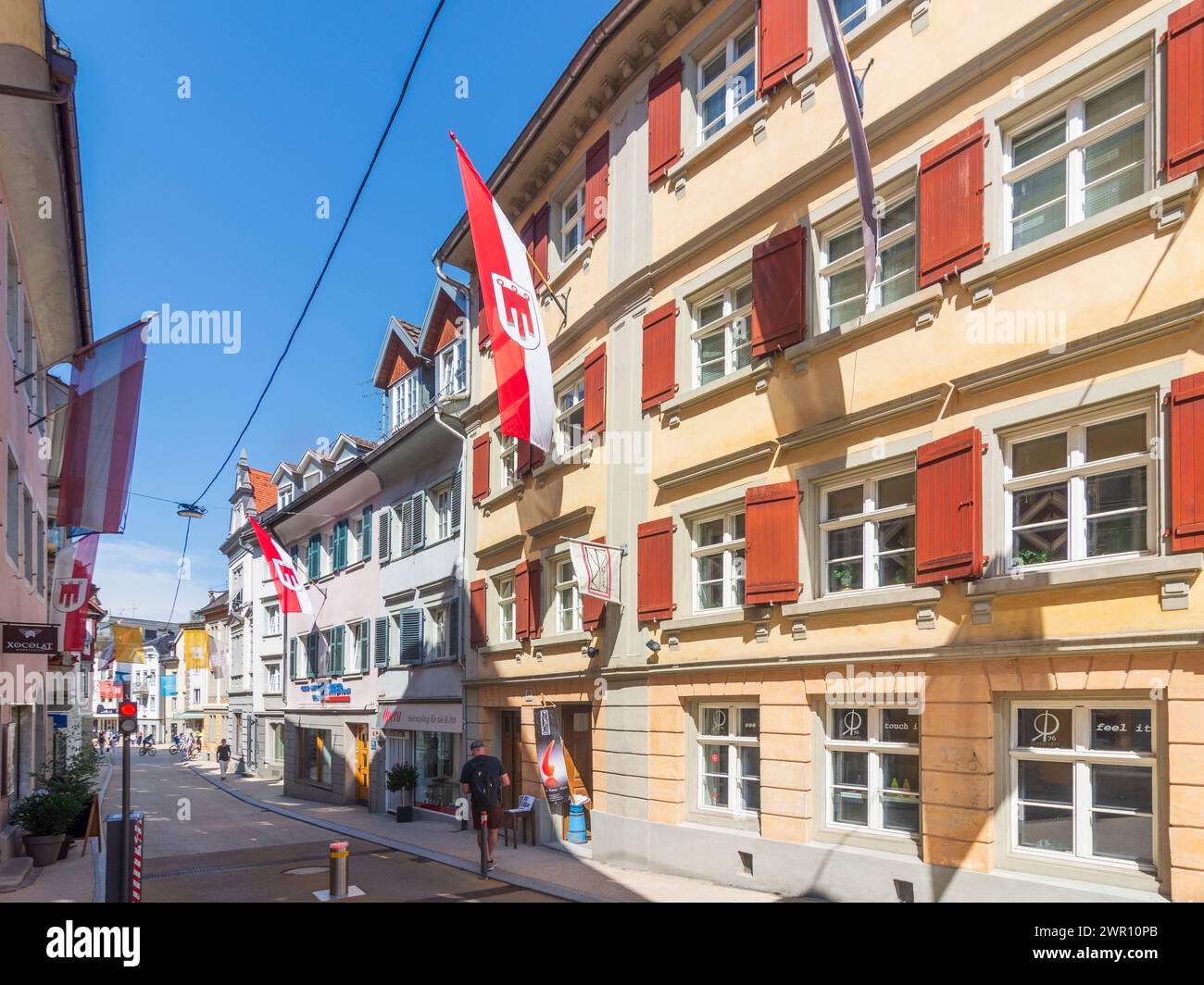 Bregenz: street Kirchstraße, Old Town, flags of Vorarlberg in Bodensee ...