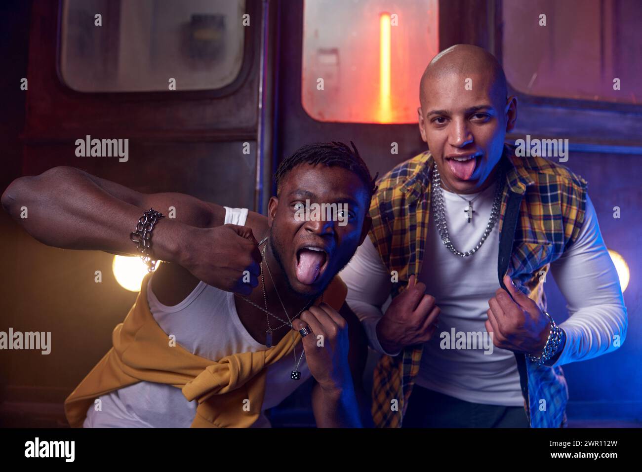Two emotional guys performing hip-hop style in underground Stock Photo ...