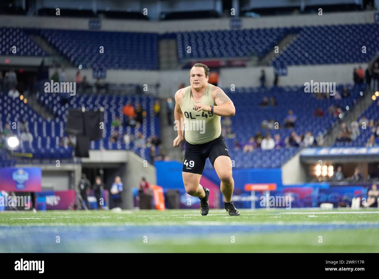 North Carolina State offensive lineman Dylan McMahon runs a drill at ...