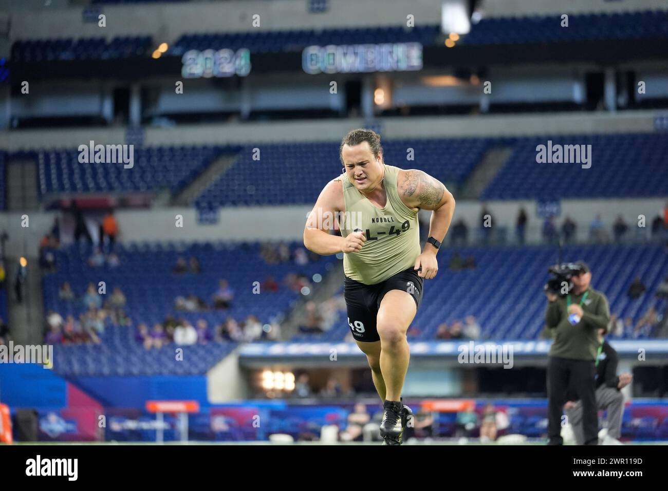 North Carolina State offensive lineman Dylan McMahon runs a drill at ...