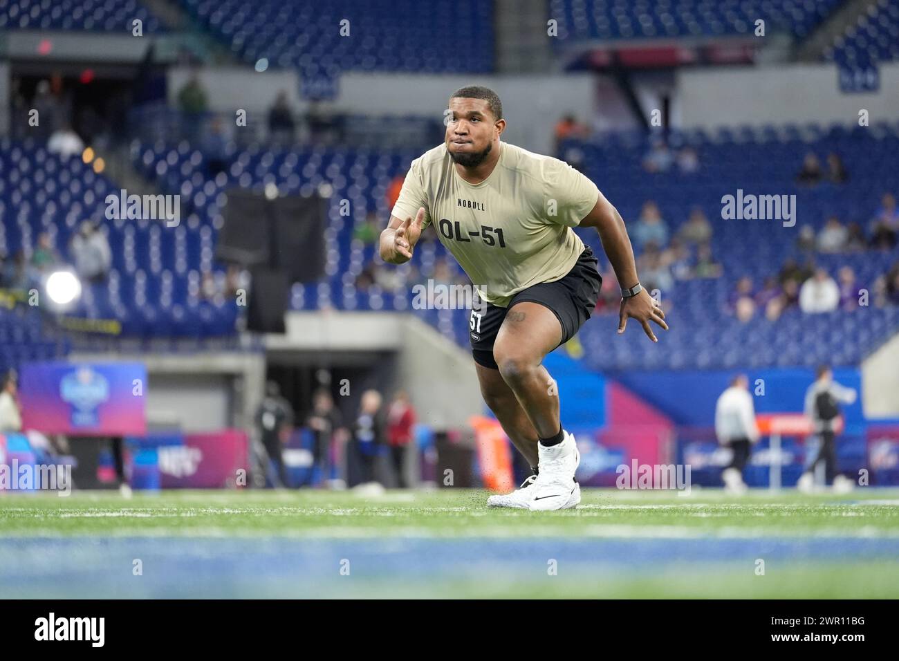 Duke offensive lineman Jacob Monk runs a drill at the NFL football scouting combine, Sunday ...