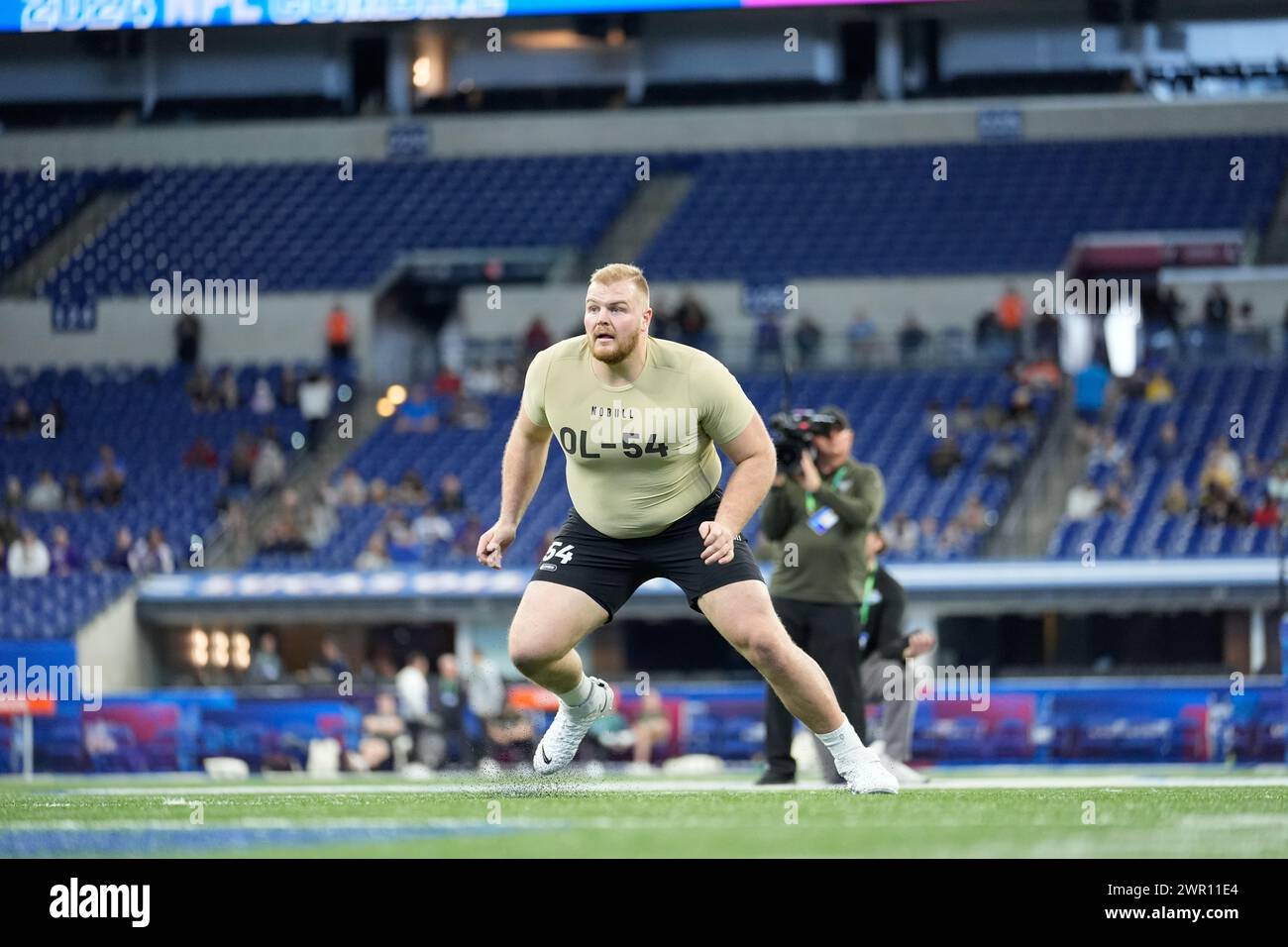 Michigan offensive lineman Drake Nugent runs a drill at the NFL ...