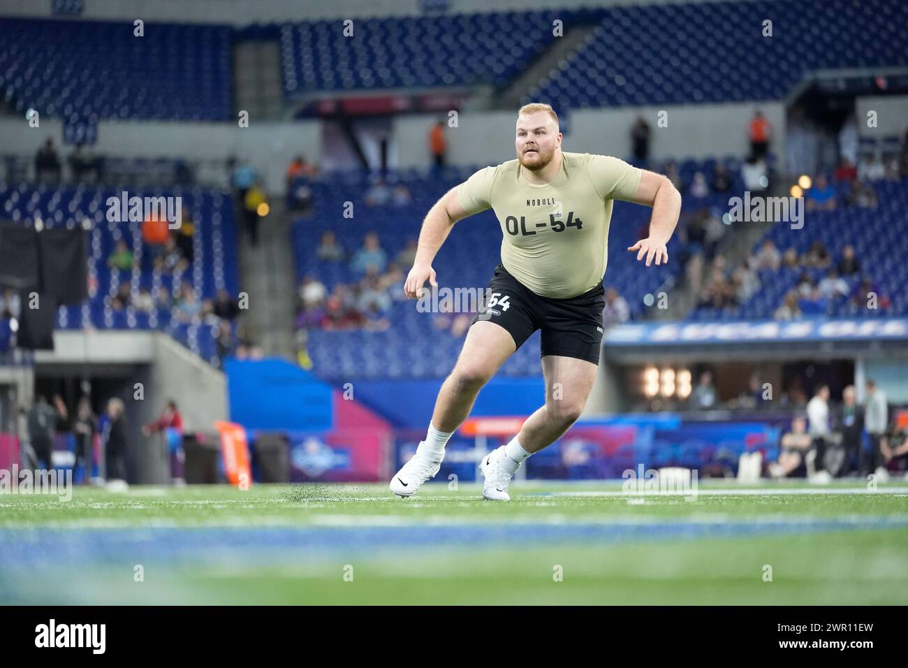 Michigan offensive lineman Drake Nugent runs a drill at the NFL ...