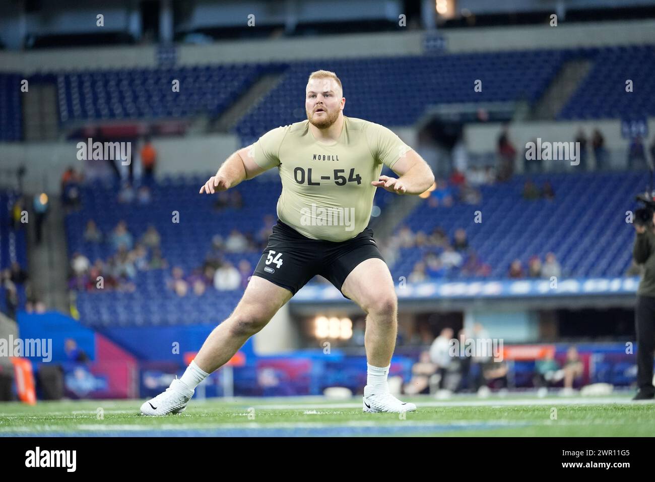 Michigan offensive lineman Drake Nugent runs a drill at the NFL ...
