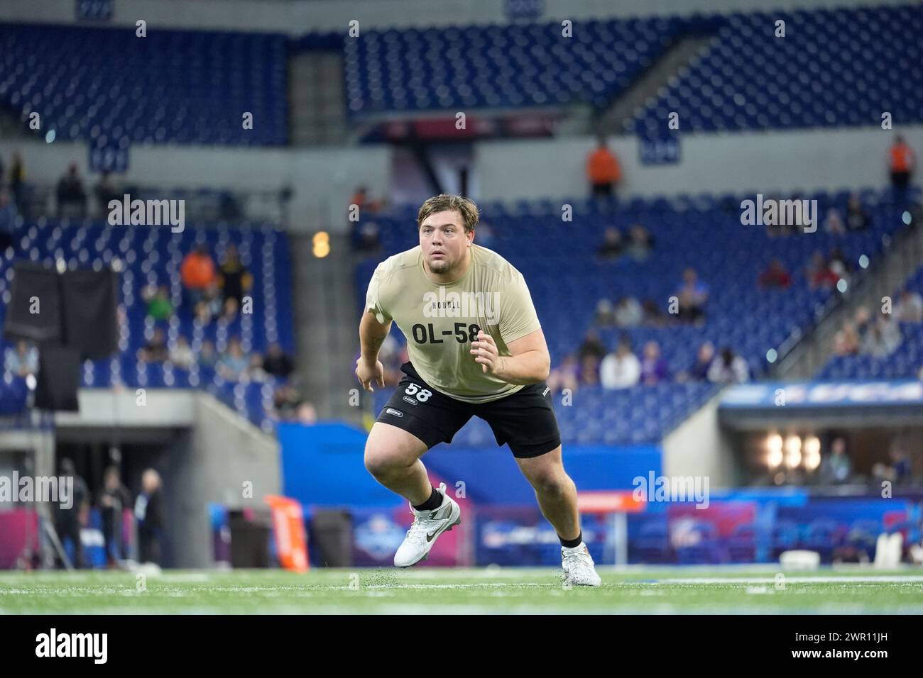 Oregon offensive lineman Jackson Powers-Johnson runs a drill at the NFL ...
