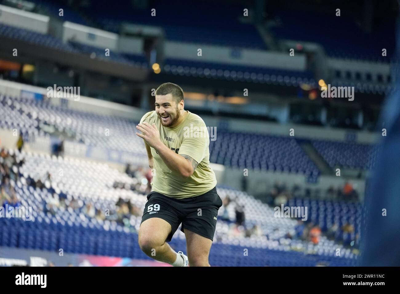 Kansas offensive lineman Dominick Puni runs a drill at the NFL football ...