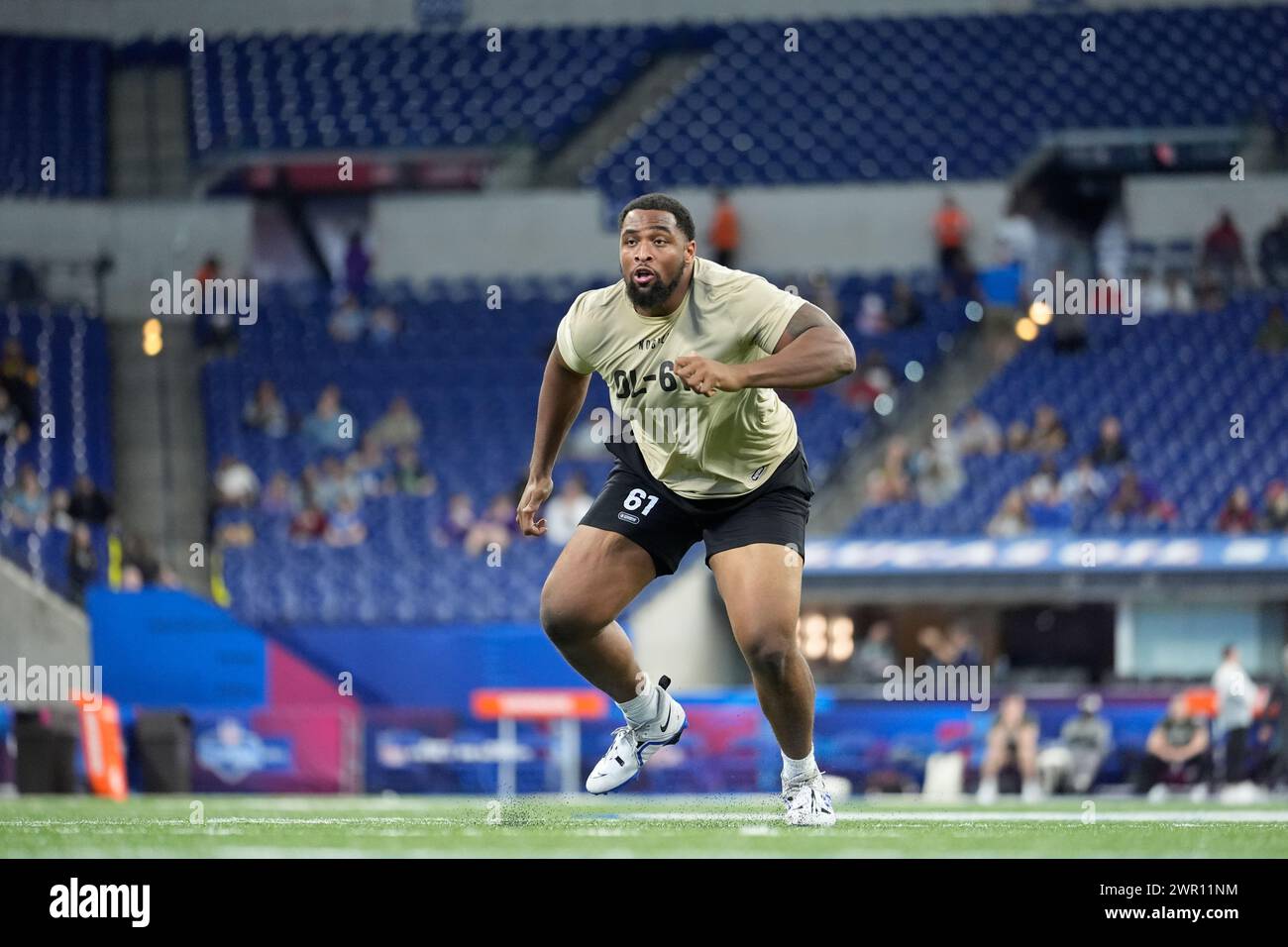 Texas A&M offensive lineman Layden Robinson runs a drill at the NFL football scouting combine ...