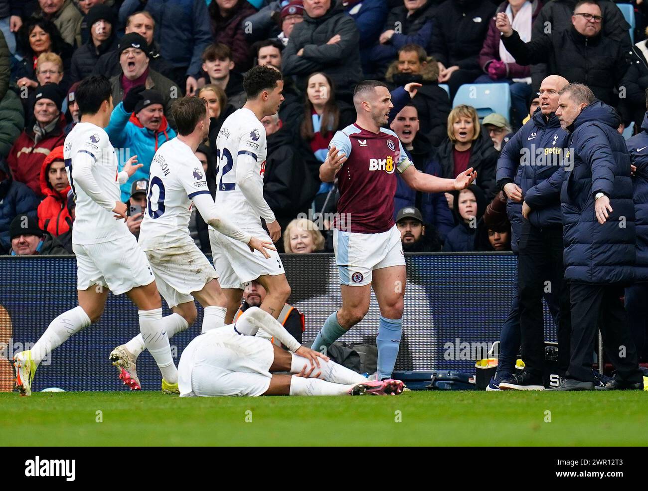Aston Villa's John McGinn (centre) is confronted by Tottenham Hotspur ...