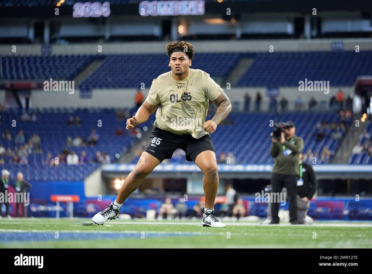 Brigham Young offensive lineman Kingsley Suamataia runs a drill at the NFL football scouting ...