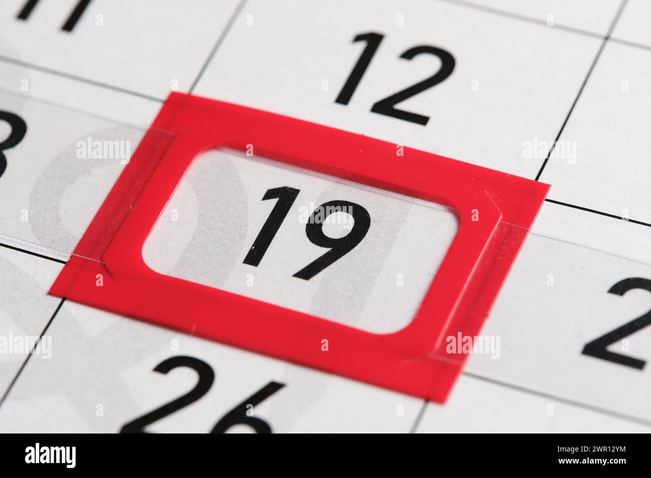 Calendar date. The 19th number the calendar is highlighted in a red ...