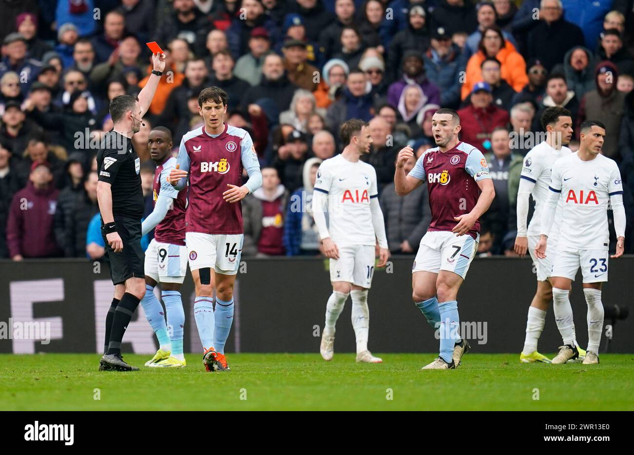 Aston Villa's John McGinn (7) is shown a red card after his challenge ...