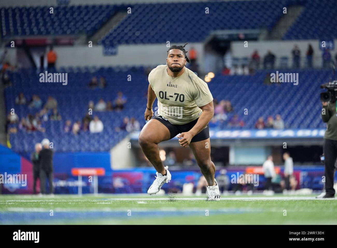 Penn State offensive lineman Caedan Wallace runs a drill at the NFL ...