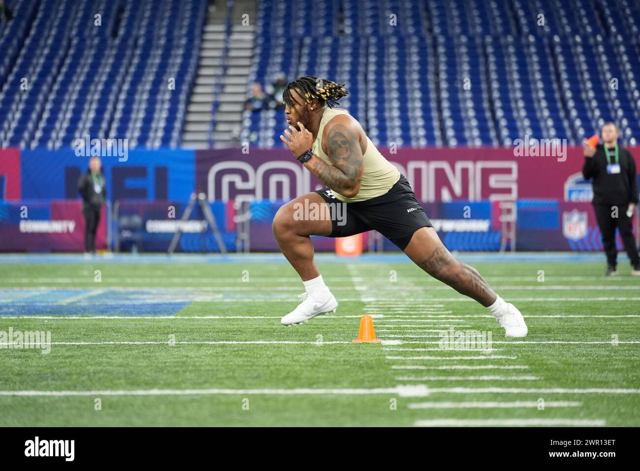 Alabama offensive lineman JC Latham runs a drill at the NFL football ...