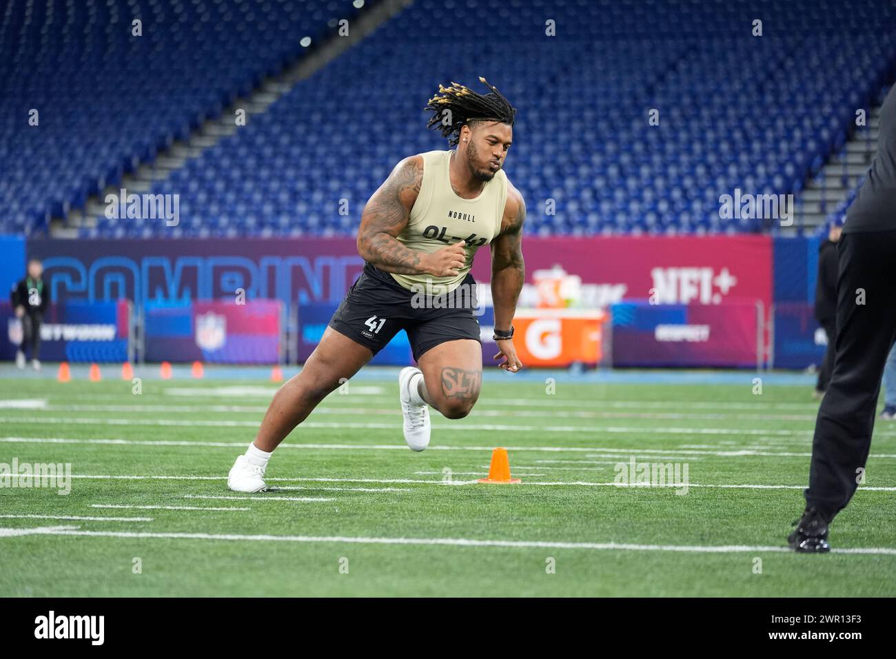 Alabama offensive lineman JC Latham runs a drill at the NFL football ...
