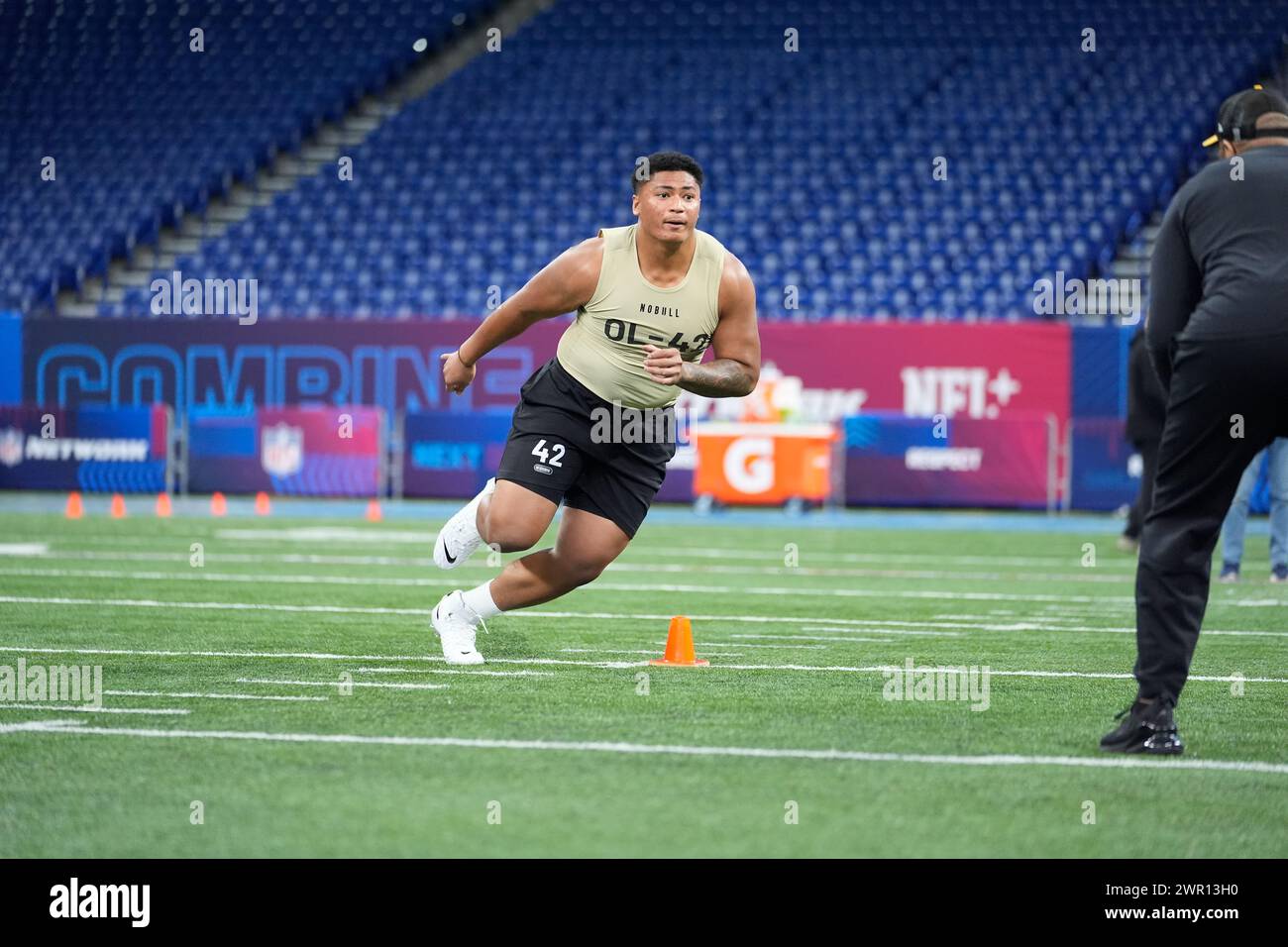 Utah offensive lineman Sataoa Laumea runs a drill at the NFL football ...