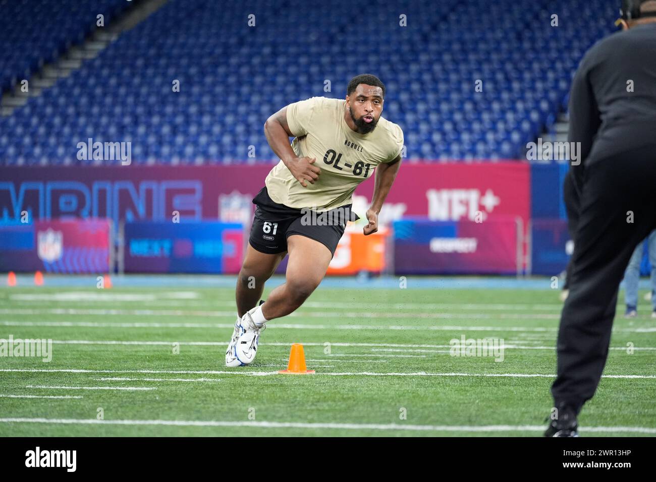 Texas A&M offensive lineman Layden Robinson runs a drill at the NFL ...
