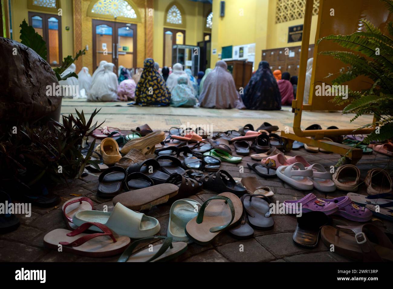 Sandals on the mosque foyer during prayers in the month of Ramadan in ...