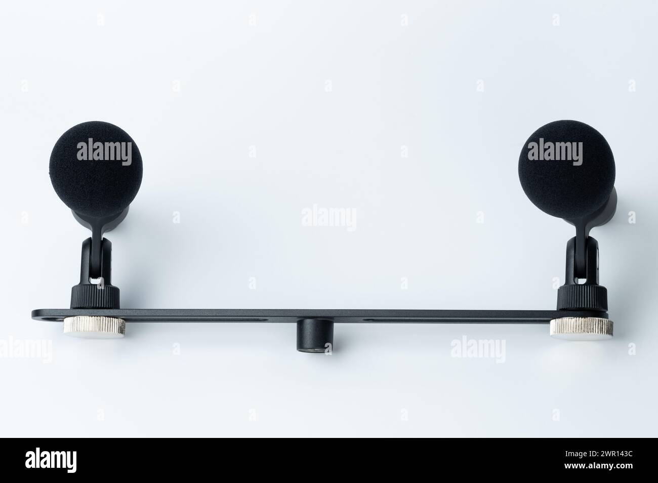 Stereo pair microphone on metal bar isolated on white studio background ...