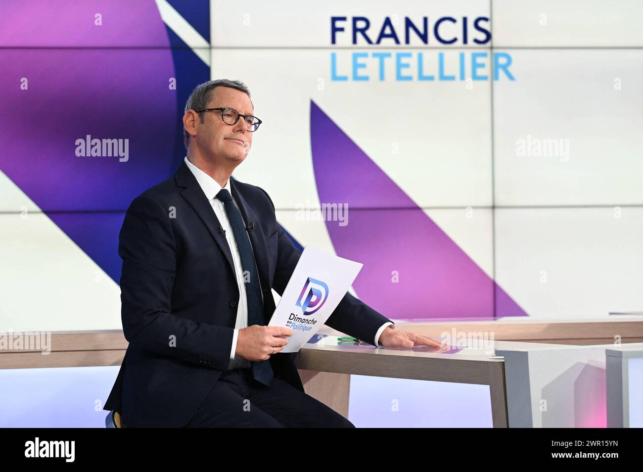 Francis Letellier, Journalist poses for pictures ahead of an interview ...