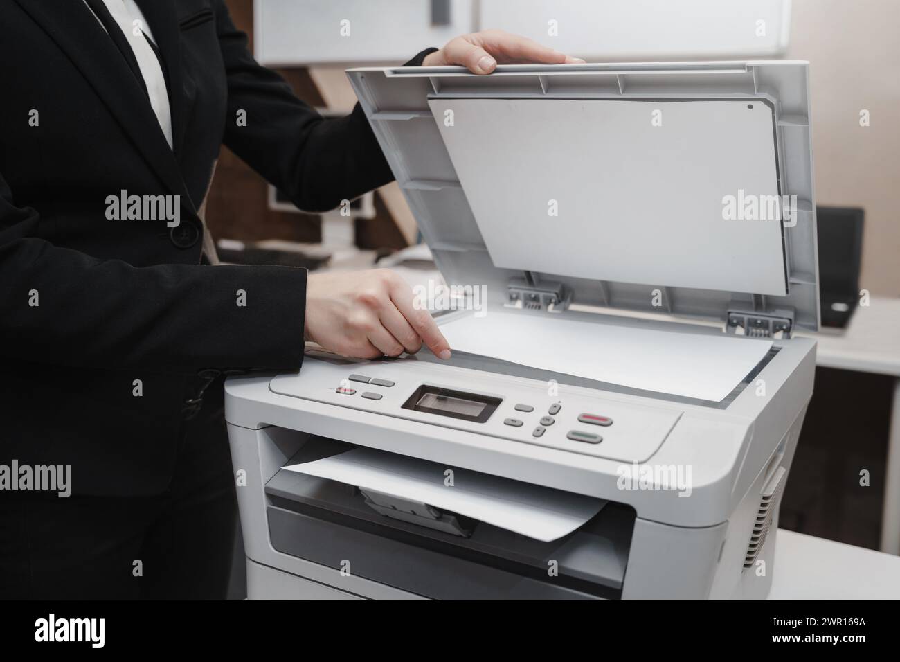 Office woman's hand with working copier scanner printer Stock Photo - Alamy