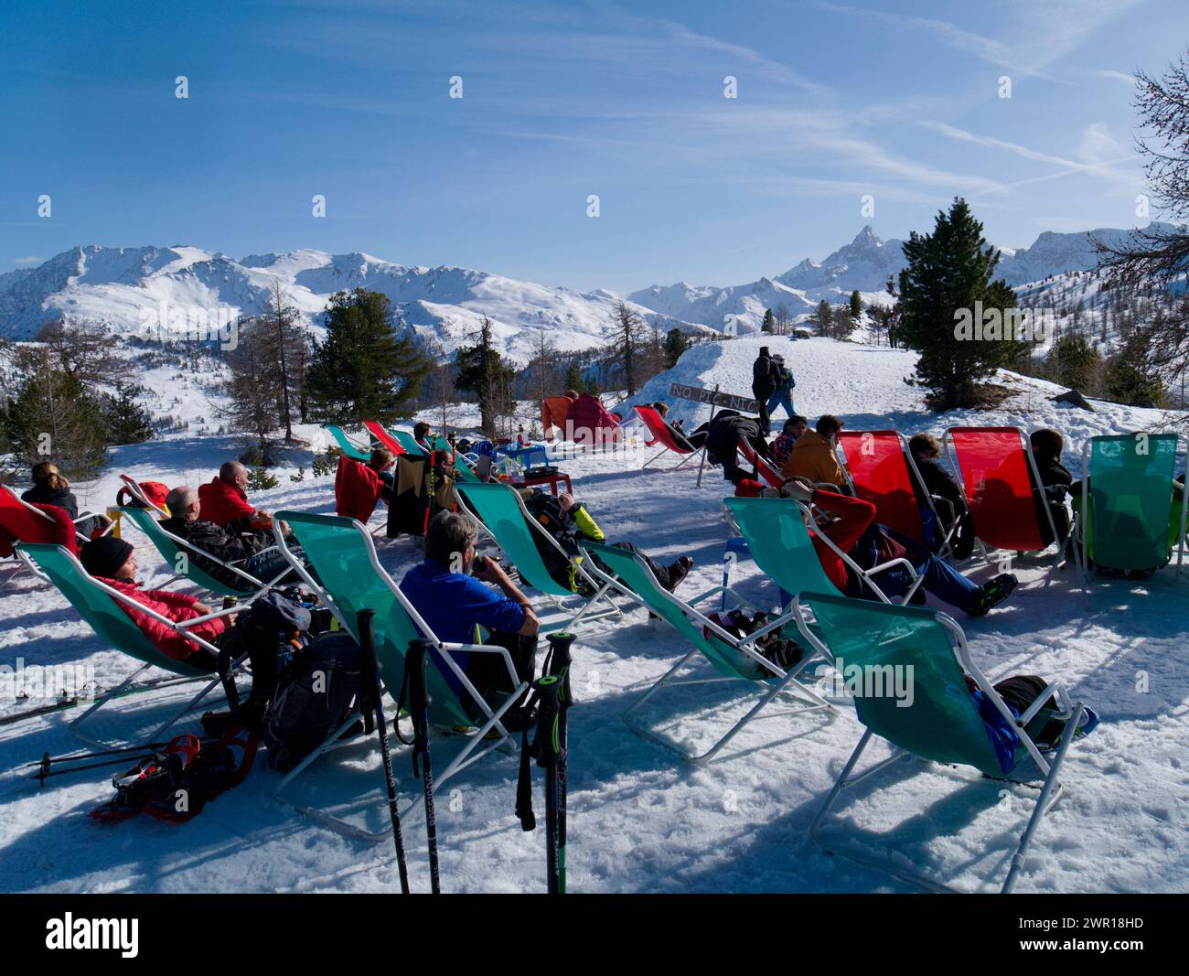 Skiers relaxing in the sun, Claviere, Italy Stock Photo - Alamy
