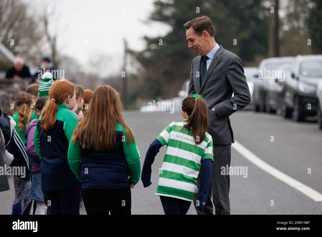 Ryan Tubridy chatting to local schoolchildren before the funeral of 12 ...