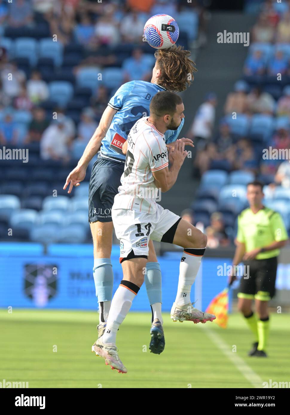 Max Barry Burgess (top) of Sydney FC team and Jack David Hingert (bottom) of Brisbane Roar FC ...
