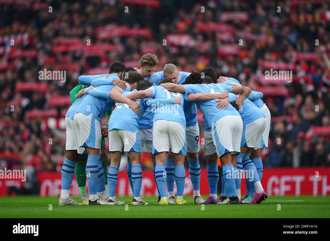 Liverpool players in a group huddle before the Premier League match at ...