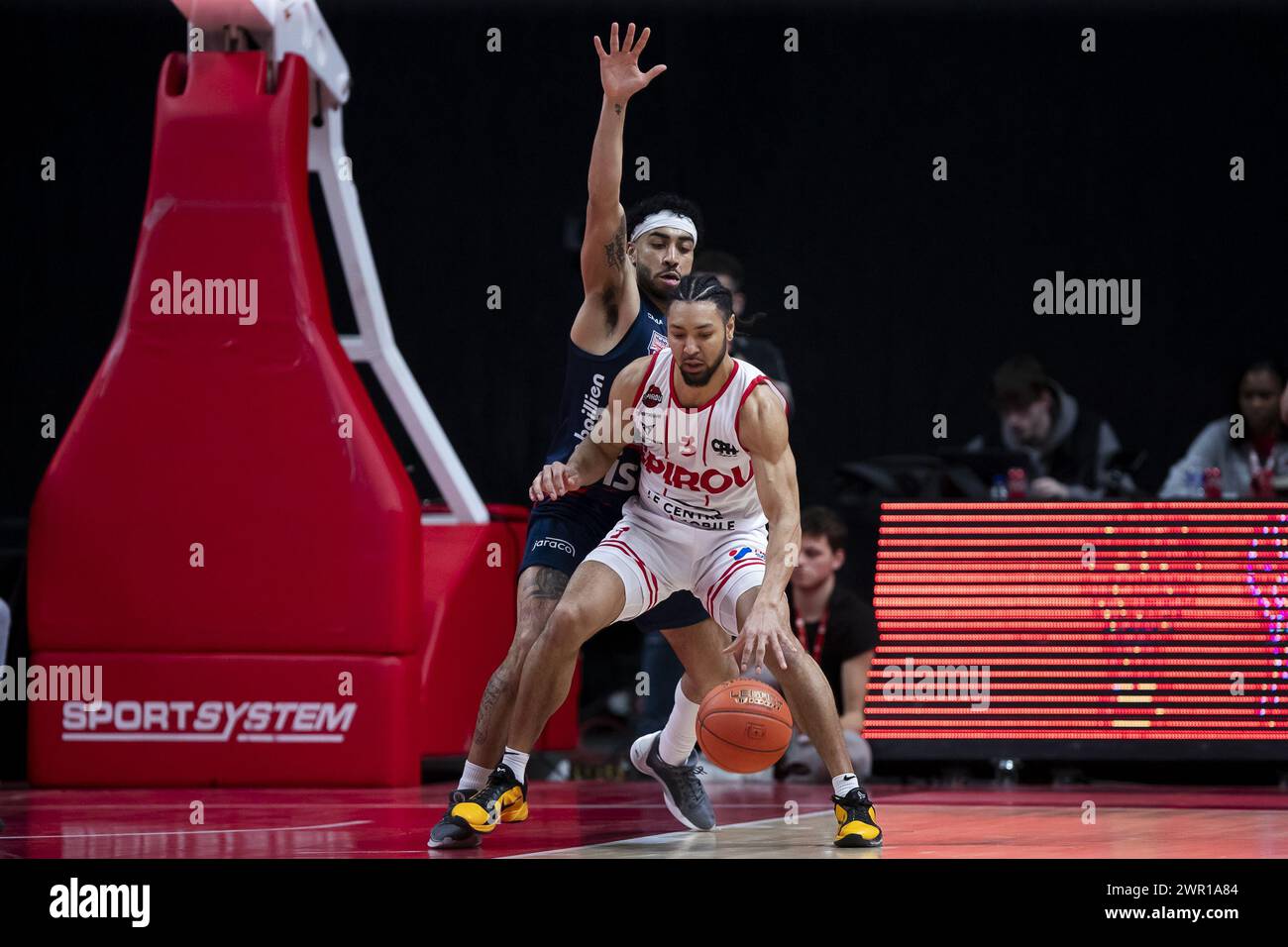 Limburg's Roman Penn and Spirou's Joshua Heath pictured in action ...