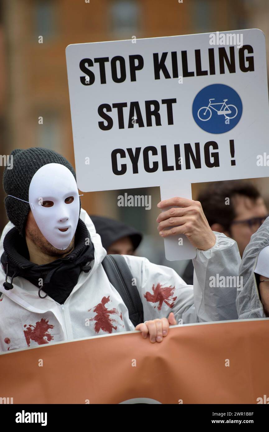 Rome, Italy. 10th Mar, 2024. A masked man in a white suit stained with ...