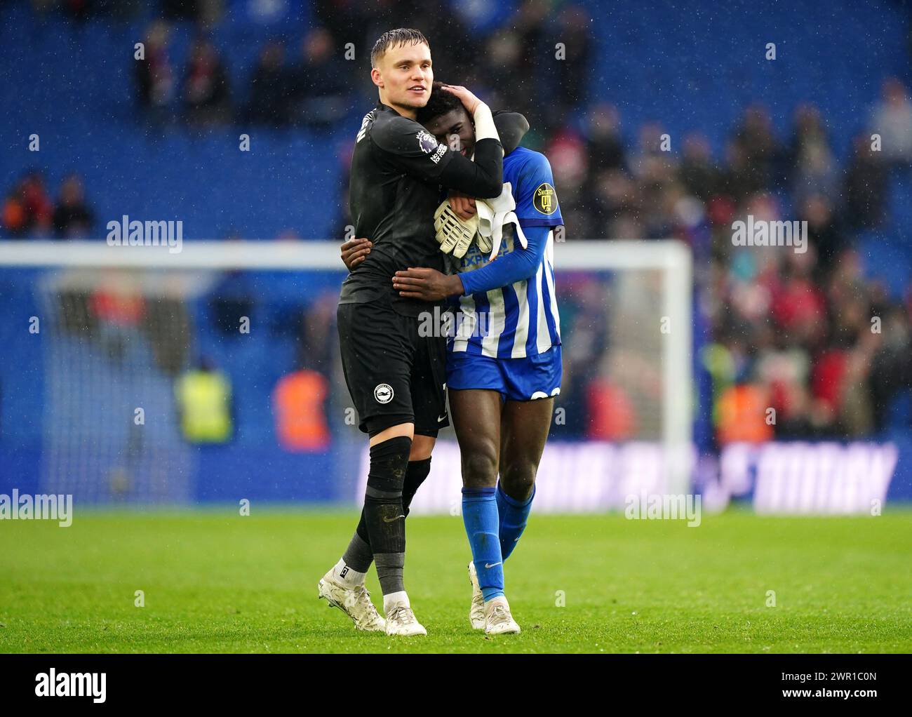 Brighton and Hove Albion goalkeeper Bart Verbruggen and Carlos Baleba ...