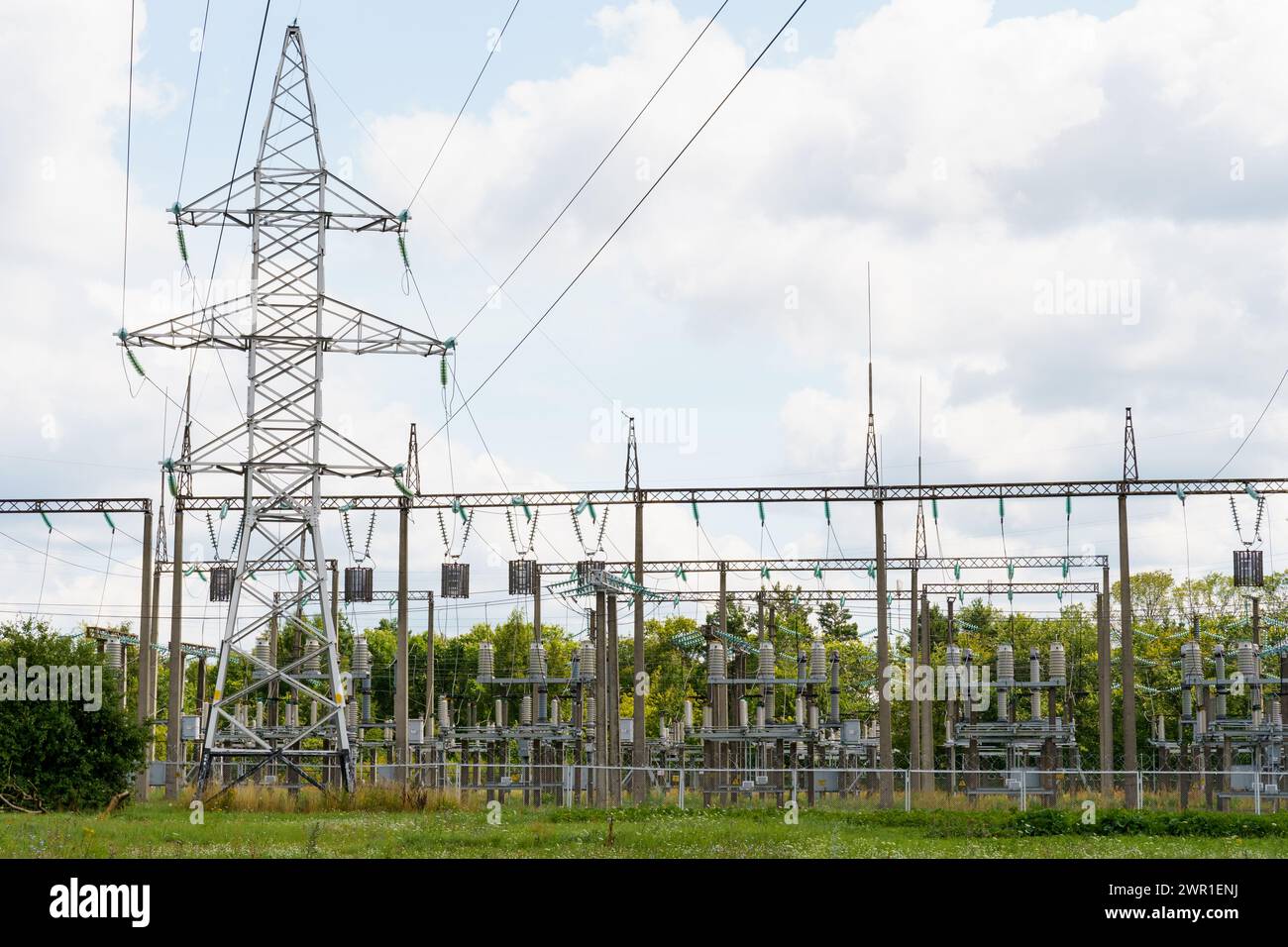 A large power line structure supported by sturdy towers, carrying ...