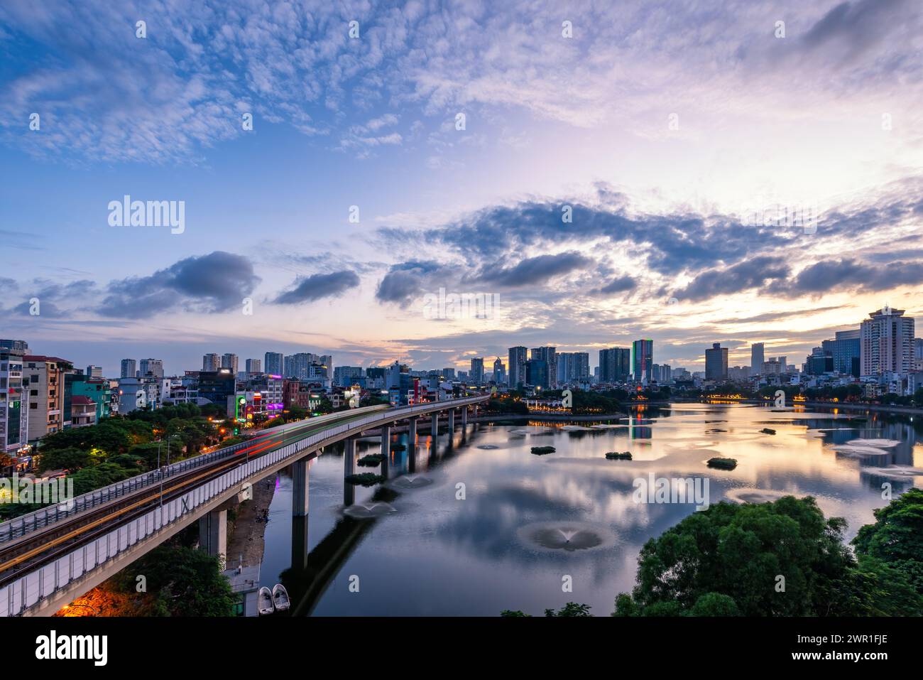 Hanoi cityscape at twilight at Hoang Cau lake, with the Cat Linh-Ha ...