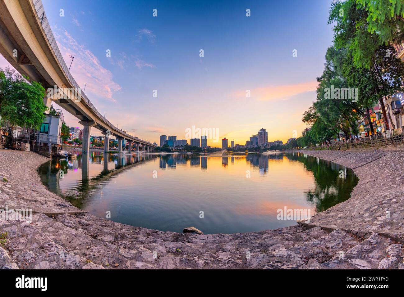 Hanoi cityscape at twilight at Hoang Cau lake, with the Cat Linh-Ha ...