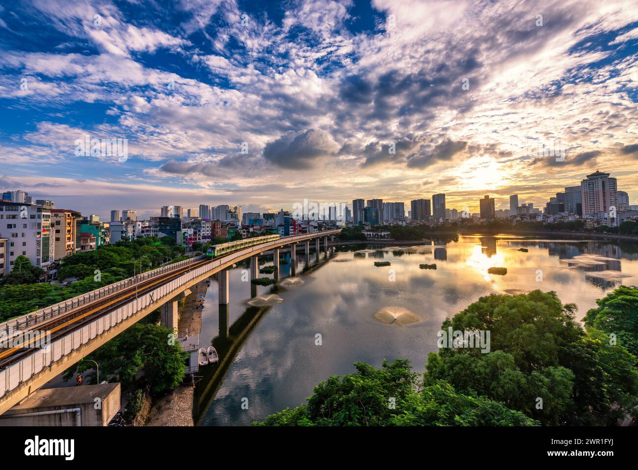 Hanoi cityscape at twilight at Hoang Cau lake, with the Cat Linh-Ha ...