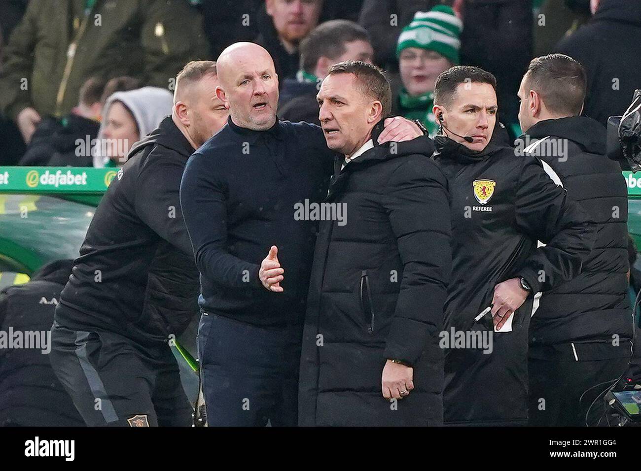 Livingston manager David Martindale (left) embraces Celtic manager ...