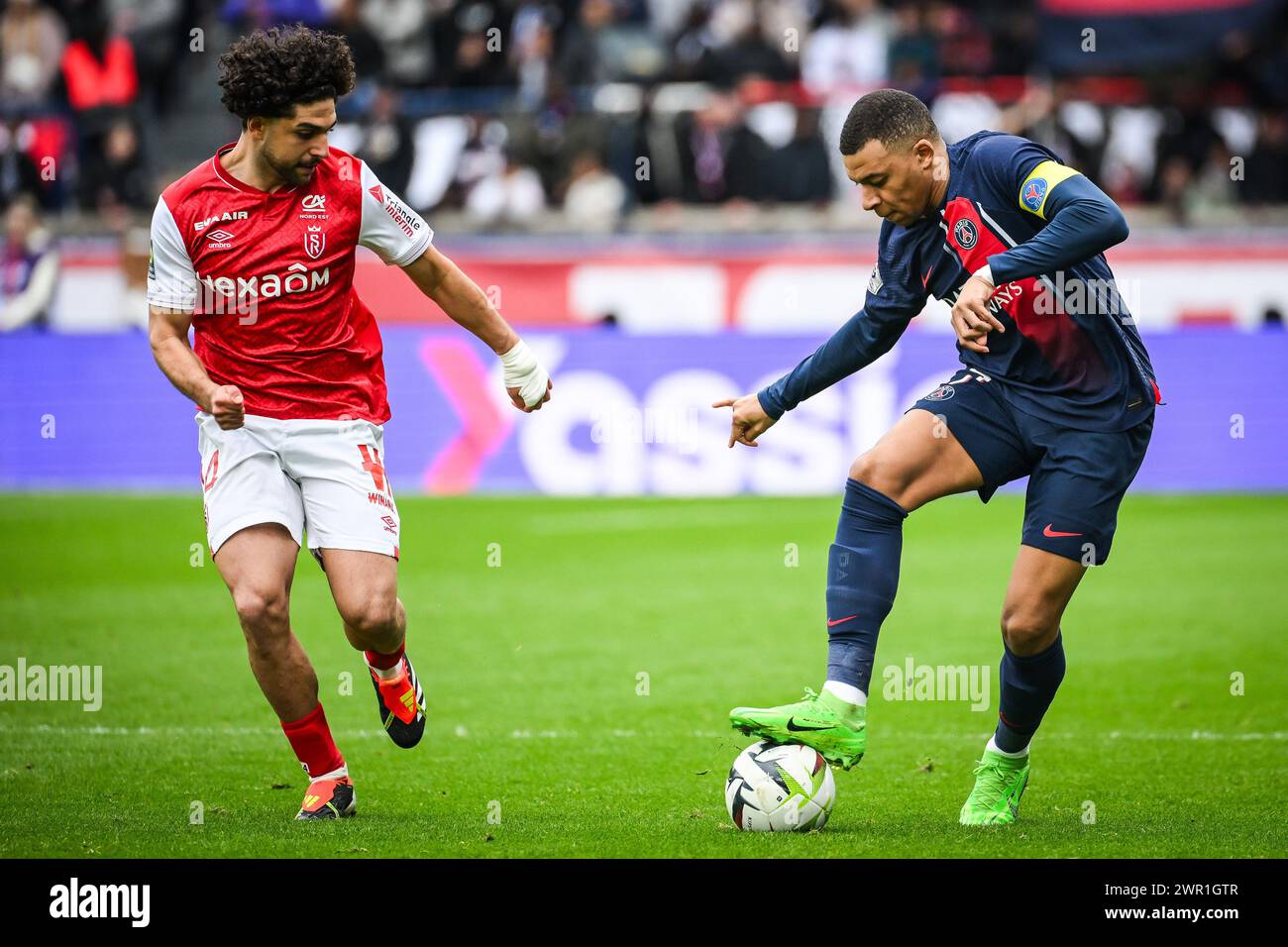 Reda KHADRA of Reims and Kylian MBAPPE of PSG during the French championship Ligue 1 football ...