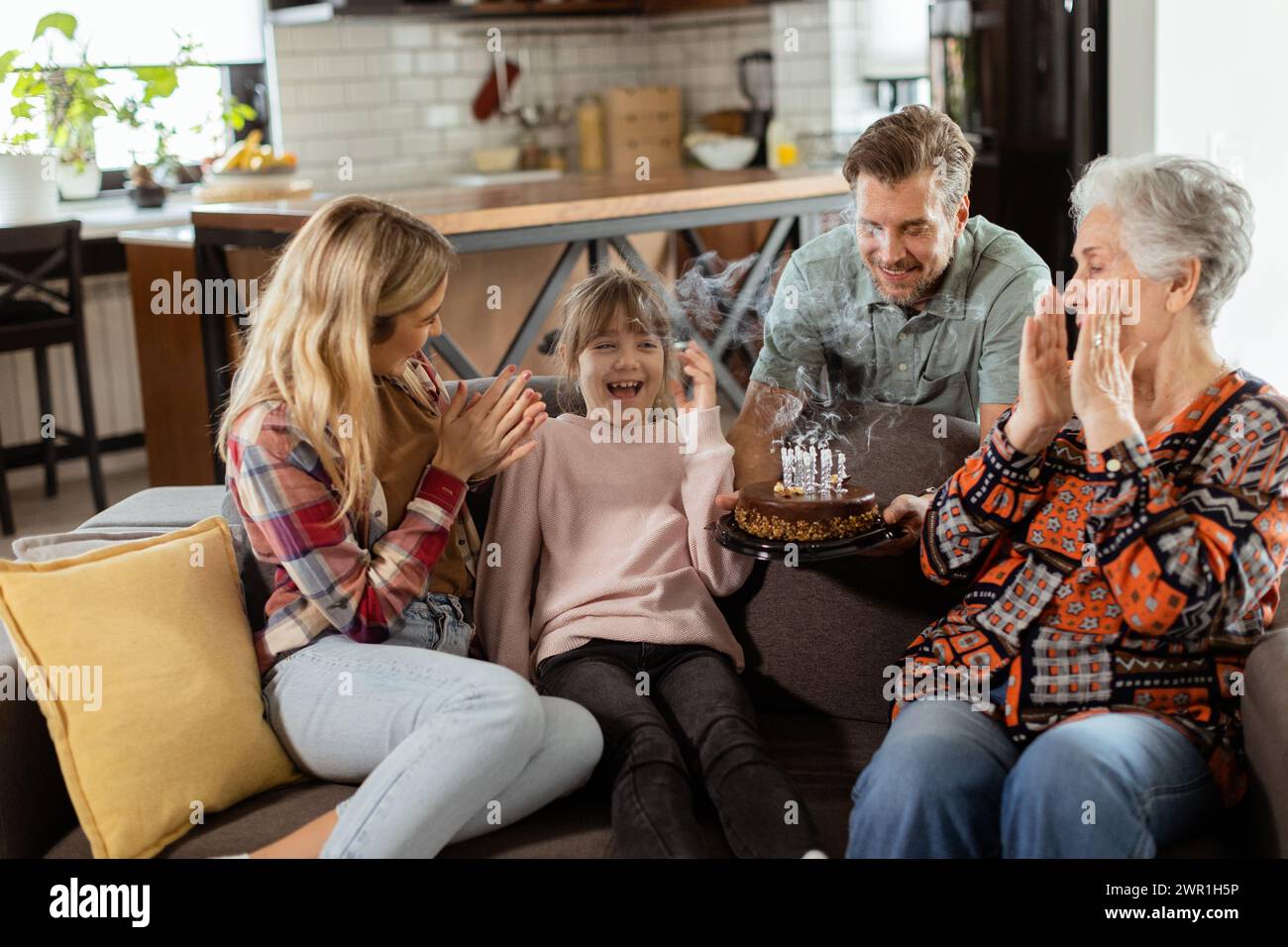 Heartwarming scene unfolds as a multi-generational family gathers on a ...