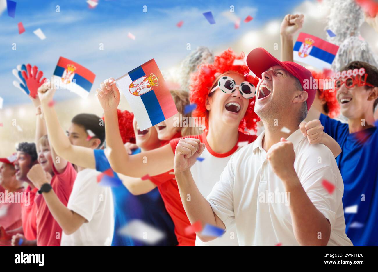 Serbia football supporter on stadium. Serbian fans on soccer pitch ...