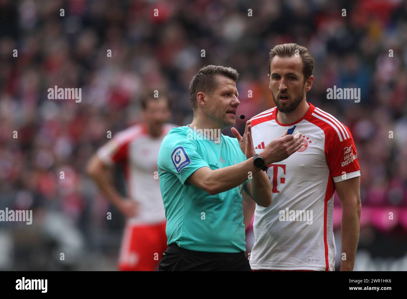 MUNICH, Germany - 9. MARCH 2024: Referee, Patrick ITTRICH, 9 Harry KANE, during the Bundesliga ...
