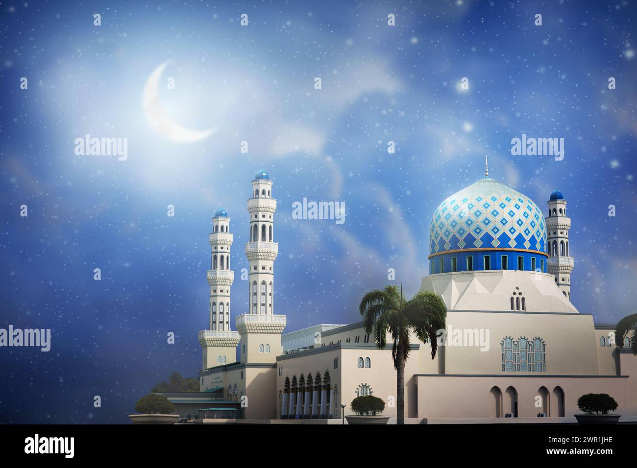 Ramadan Kareem greeting. Holy Islamic holiday. White mosque and crescent moon on night sky with ...